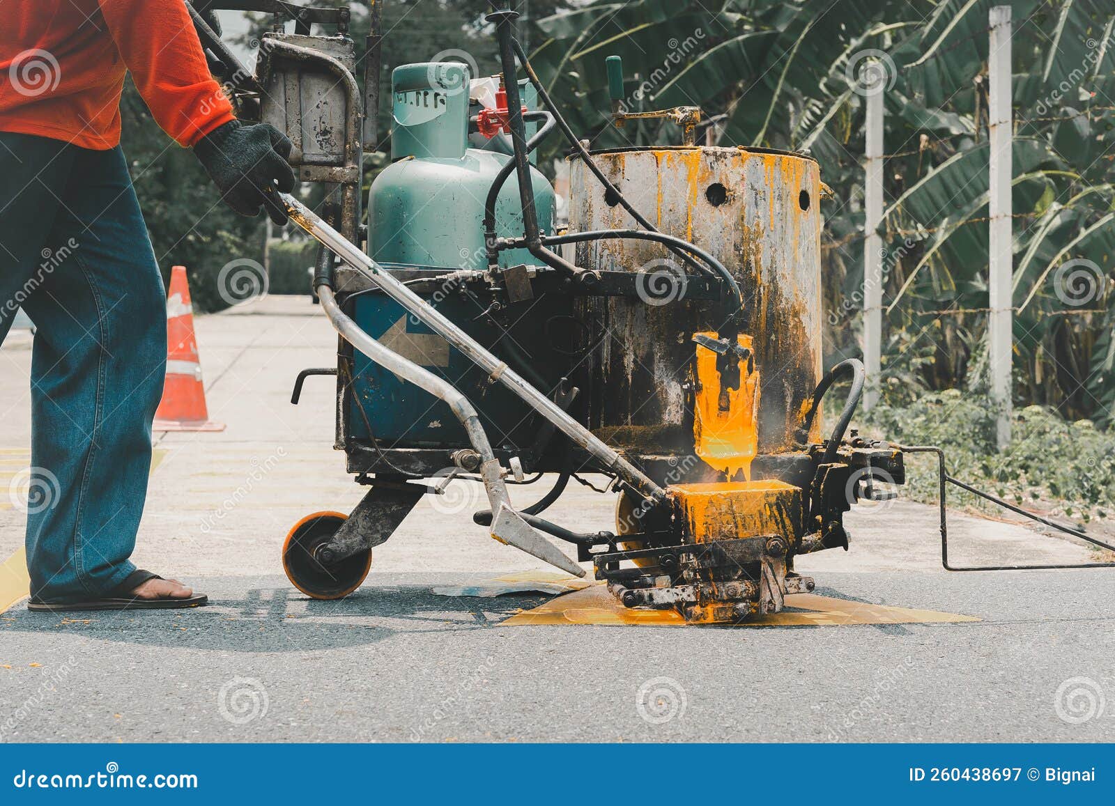 Road Worker Paint Traffic Lines on Asphalt Road Surface. Stock Image ...