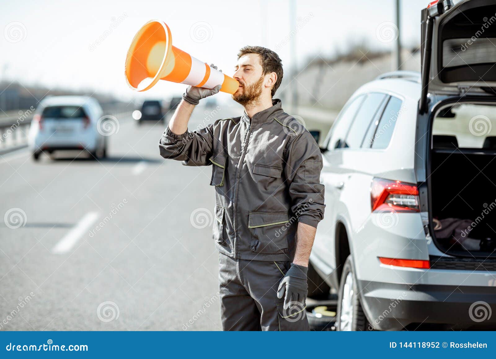 Road Worker Screaming for Help into the Road Cone Stock Photo - Image ...