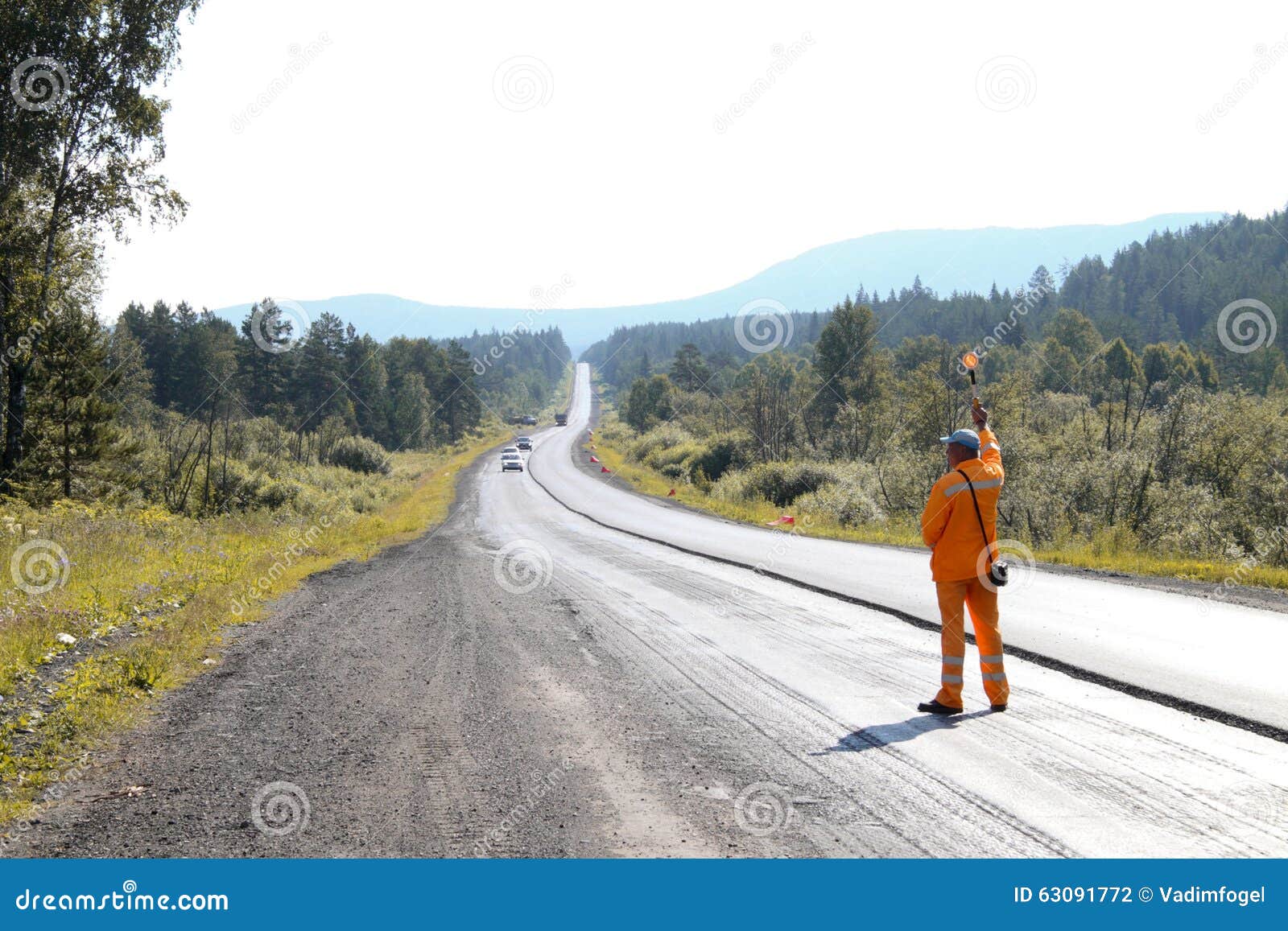 Road worker stops the car editorial photography. Image of industry ...