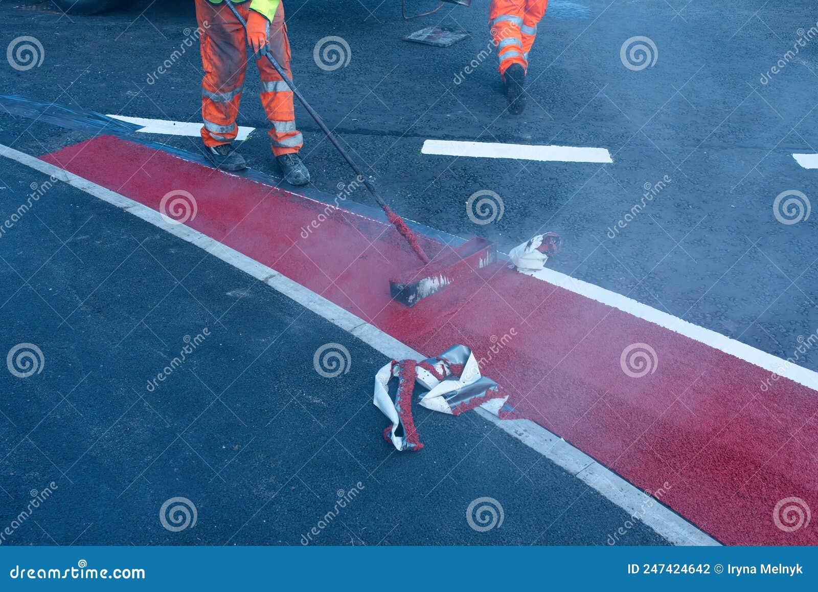 Road Workers Applying Hot Red Road Marking Paint on New Build Road ...