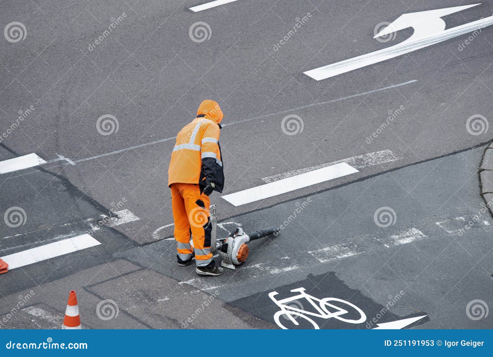 Road Workers in Orange Uniforms Renovate Road Markings Stock Image ...