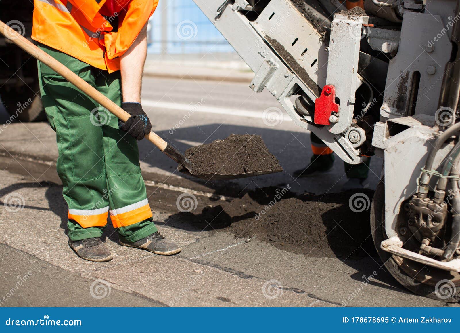 Road Workers Repair Work. Work Sleeps Shovel the Material into the ...
