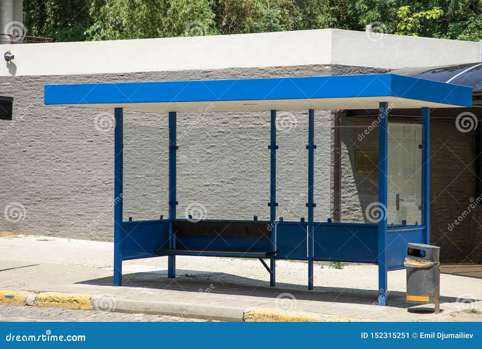 Roadside bus stop stock image. Image of glass, clouds - 152315251