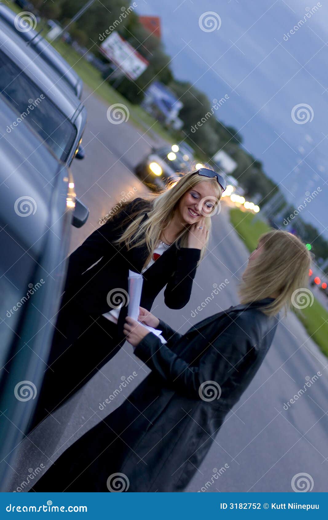 Roadside Business Discussion Stock Photo - Image of dusk, papers: 3182752