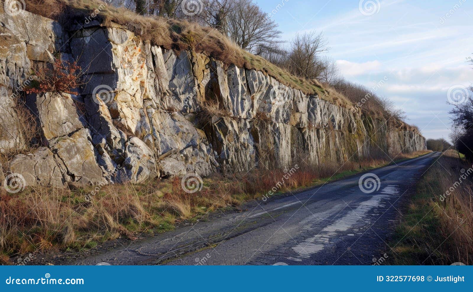 A Roadside Cliff Face Its Surface Pockmarked with Rough Irregular Scars ...