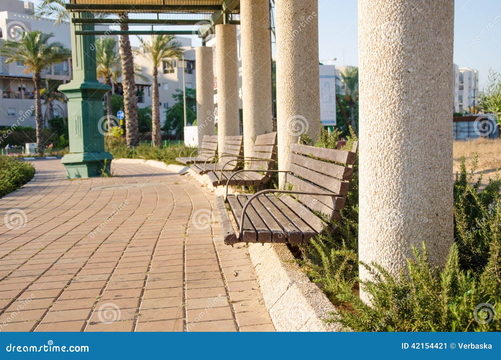 Roadside Patio of Columns and Benches Stock Image - Image of wooden ...