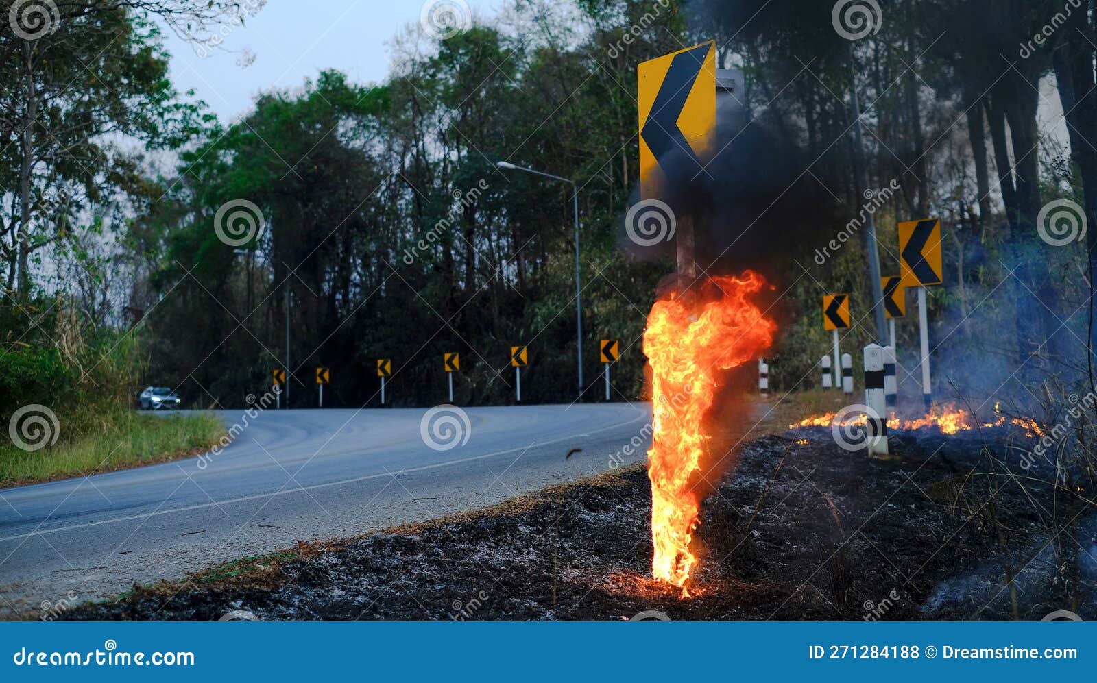 Roadside Pillar Pole is Burning with Flames and There is Smoke Rising ...