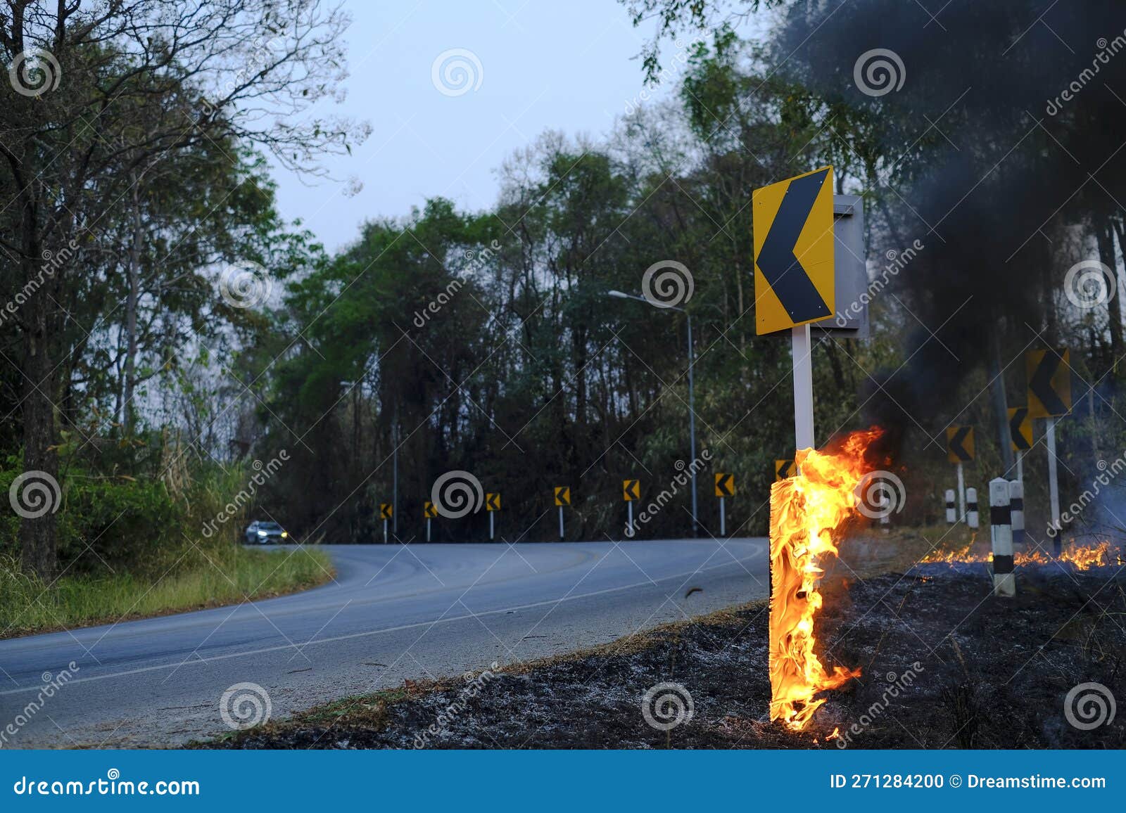 Roadside Pillar Pole is Burning with Flames and There is Smoke Rising ...