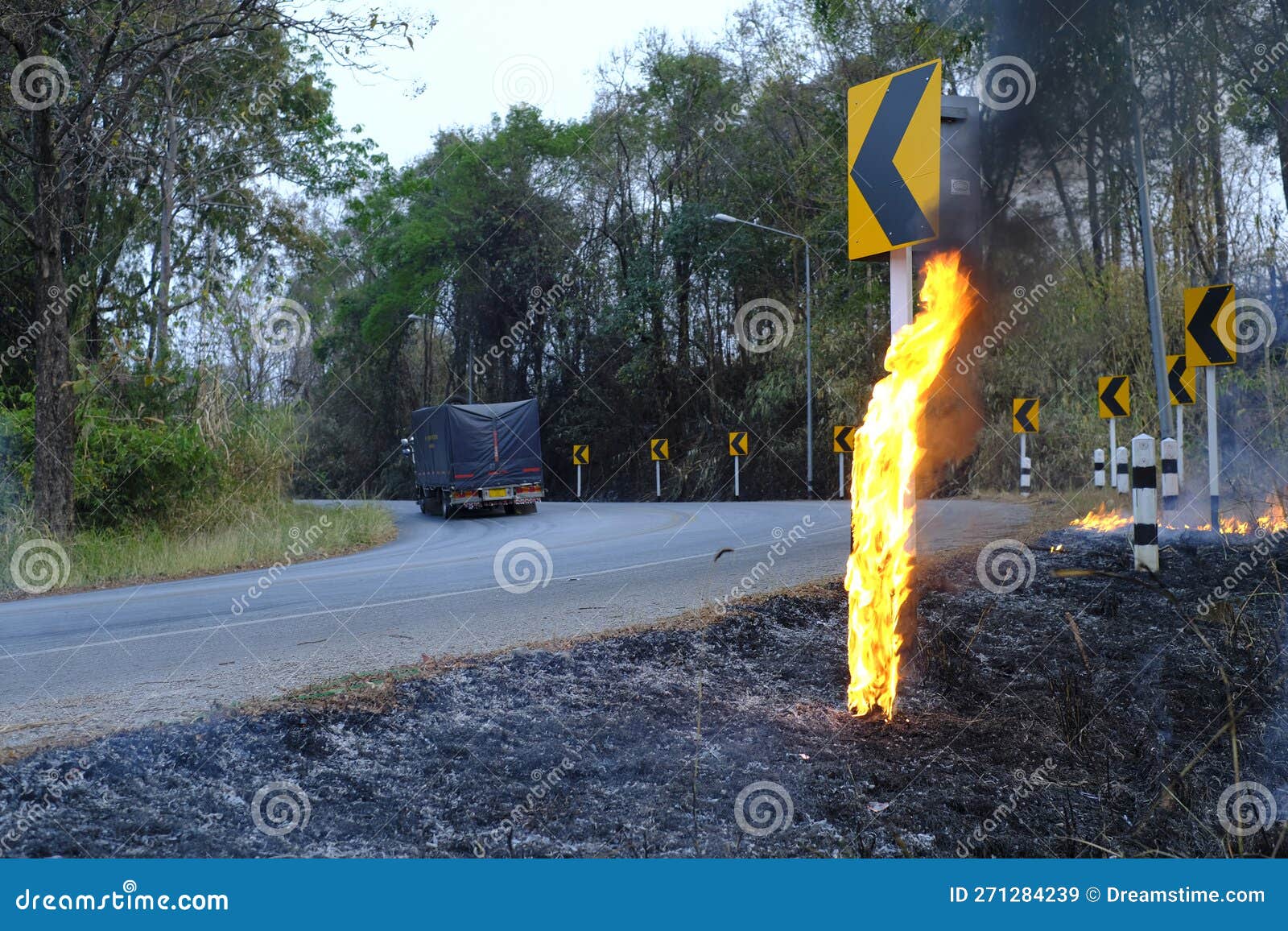 Roadside Pillar Pole is Burning with Flames and There is Smoke Rising ...