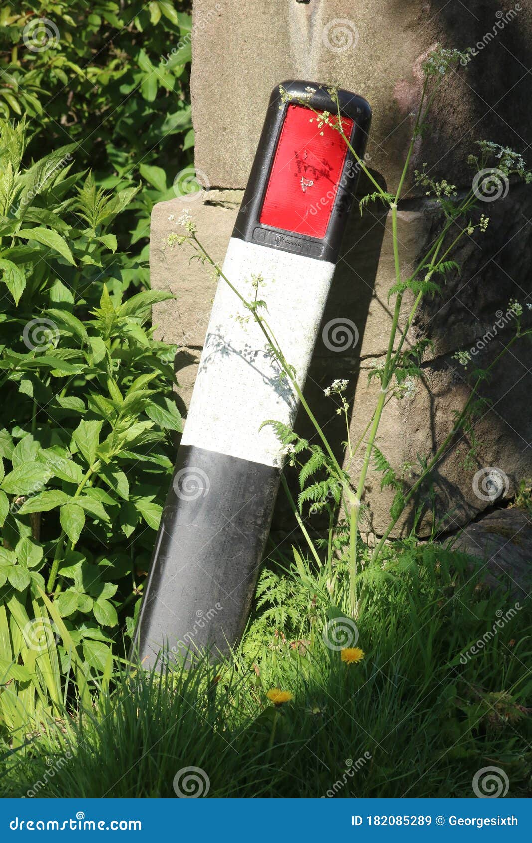 Roadside Reflective Marker Post by End Stone Wall Stock Image - Image ...