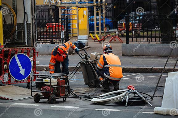 Roadworkers on Repair of Road Surface Stock Photo - Image of progress ...