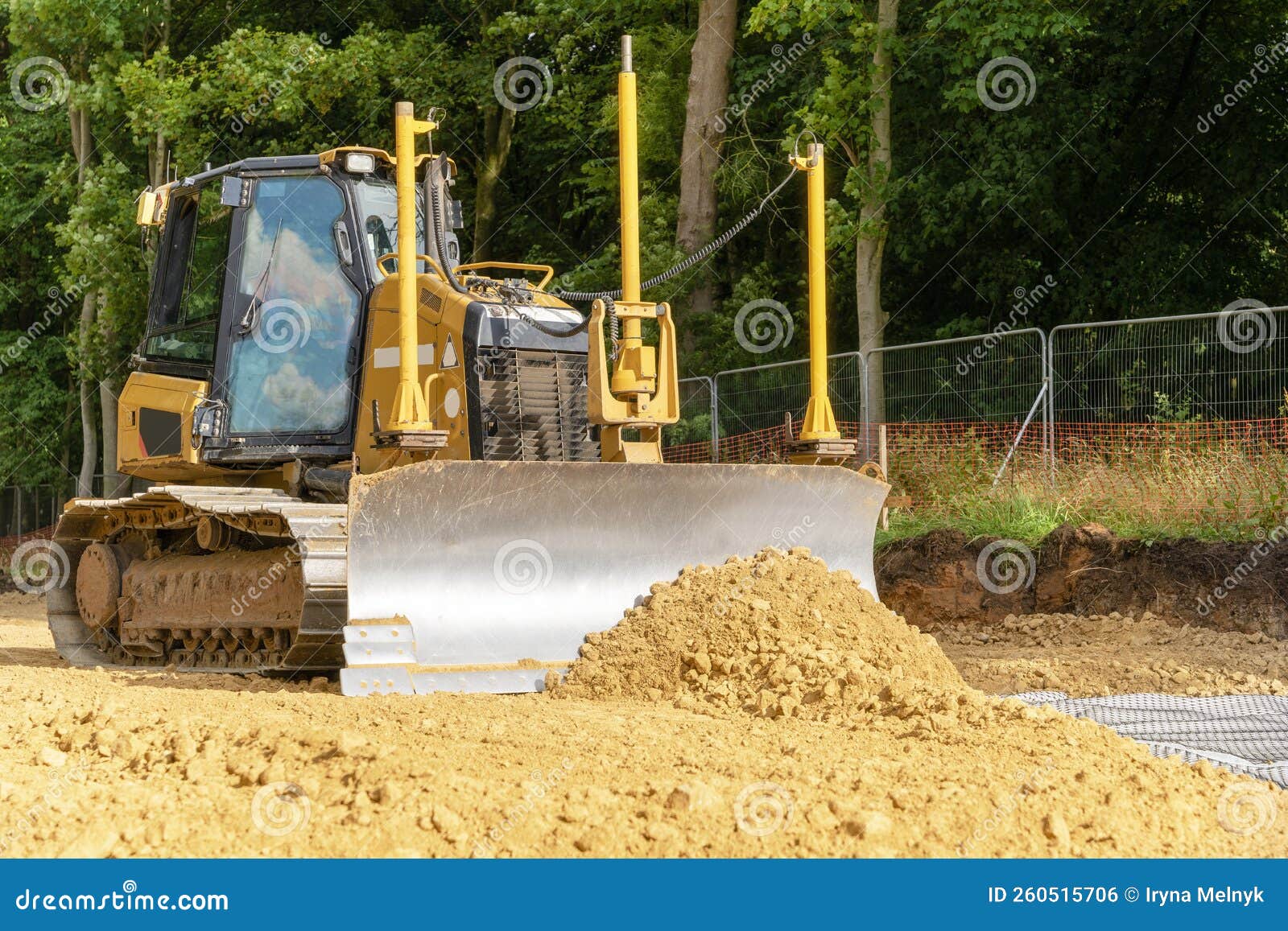 Roadworks and Bulldozer Leveling Stone on Top of Geogrid Plastic Mesh ...