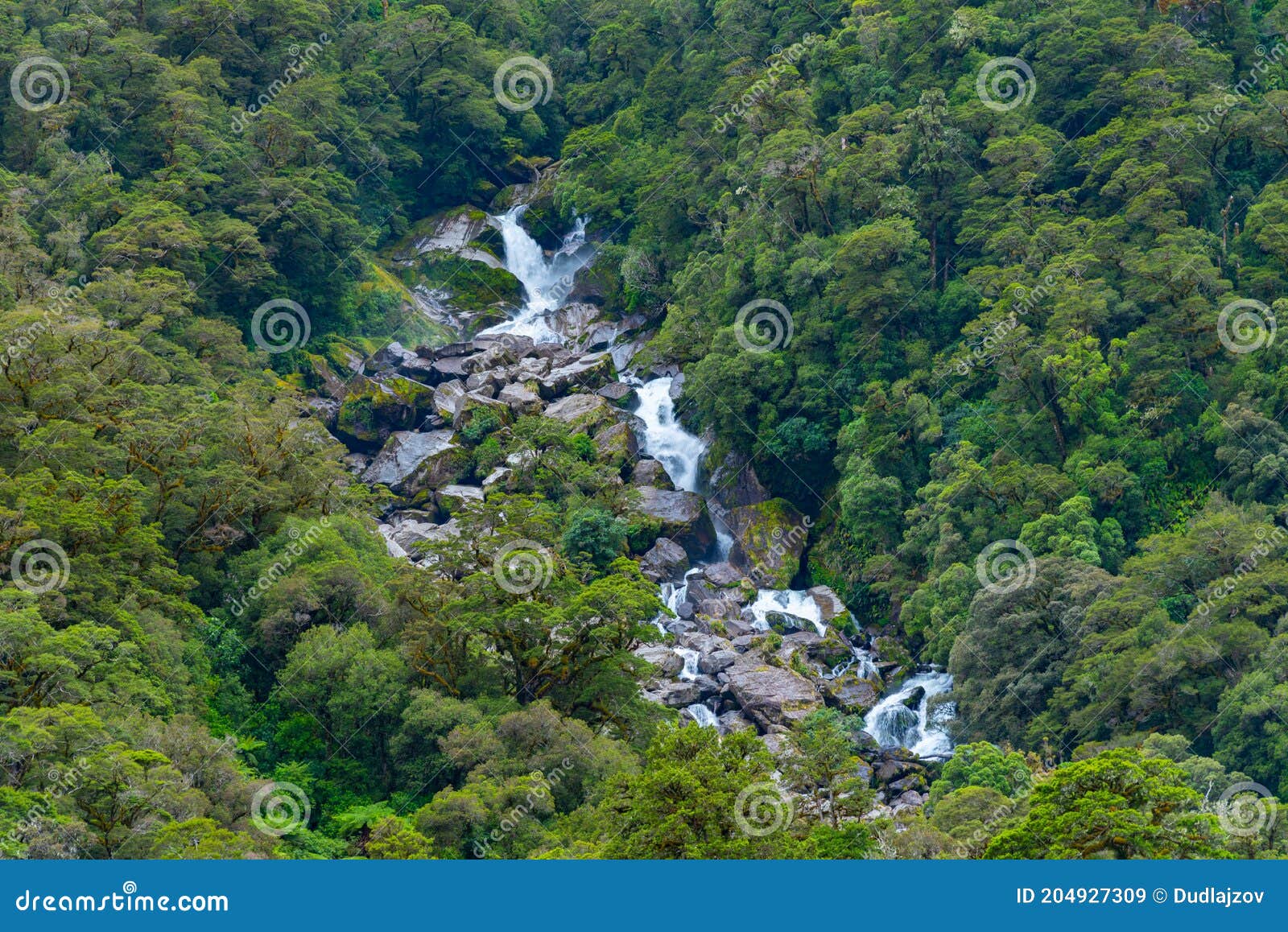 Billy Falls With The Glacial Blue River Water Flowing Over Rocks. Haast ...
