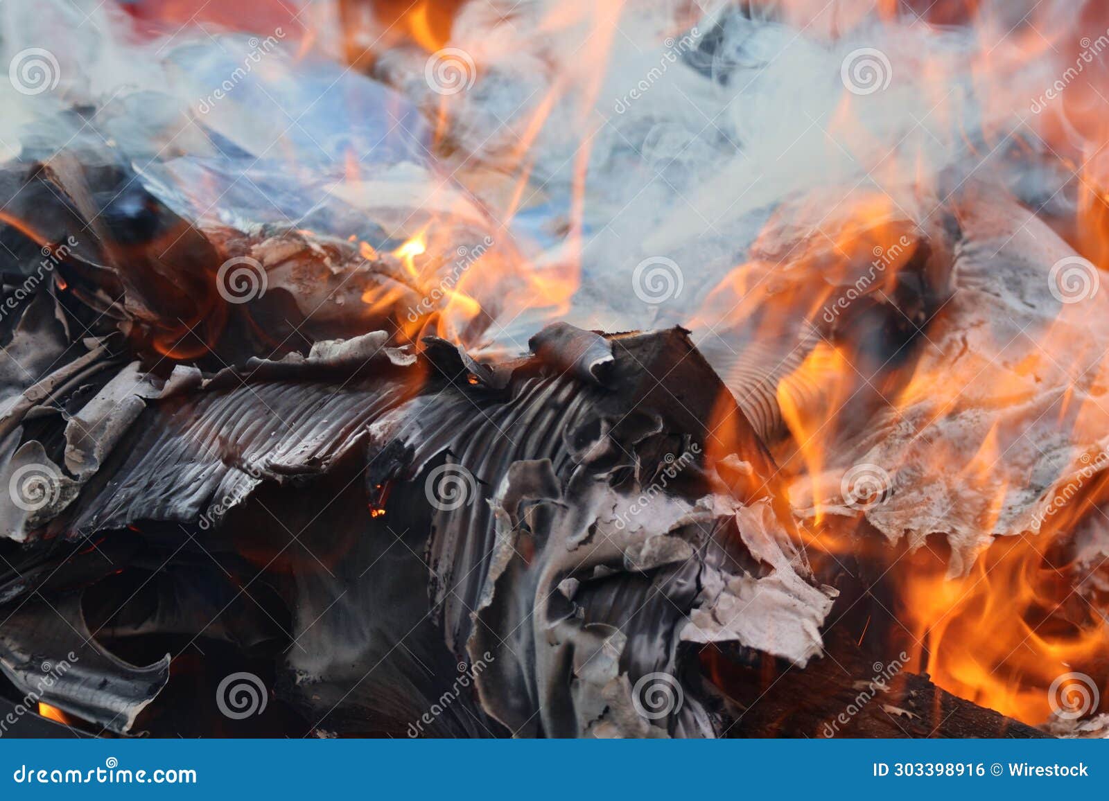 Roaring Bonfire with Paper Illuminated by an Intense Orange Glow Stock ...