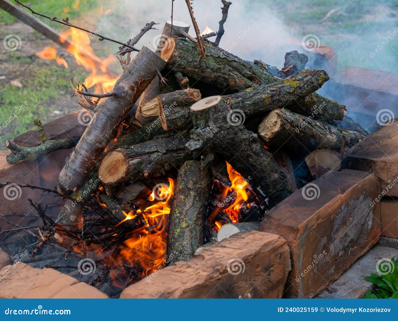 Roaring Fire with Blurred Flames from Wood Logs in a Stone Firepit ...