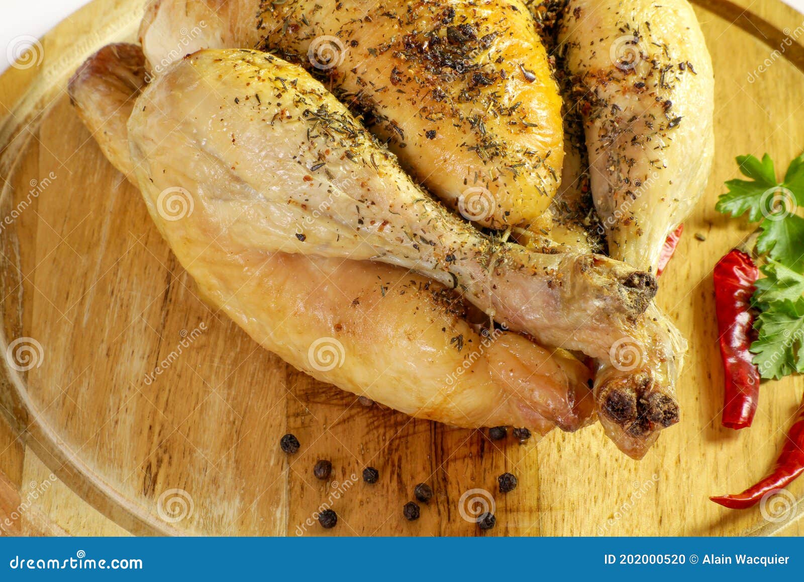 Roast chicken on a table stock photo. Image of board - 202000520