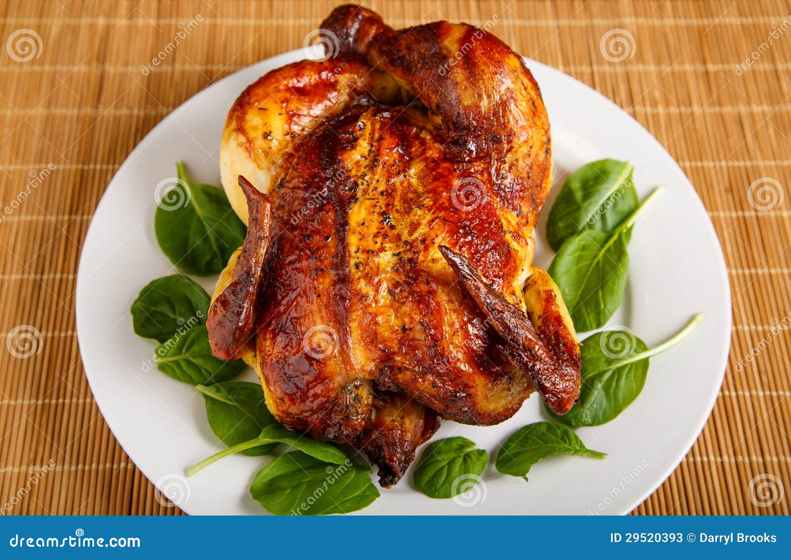 Roast Chicken on Plate Garnished with Spinach Leaves Stock Image ...