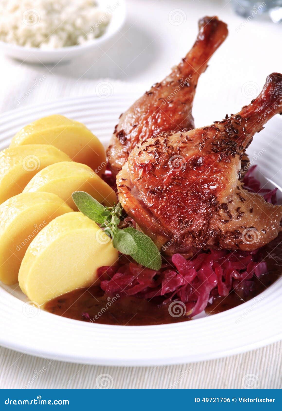 Roast Duck Legs with Braised Cabbage and Potato Dumplings Stock Photo ...
