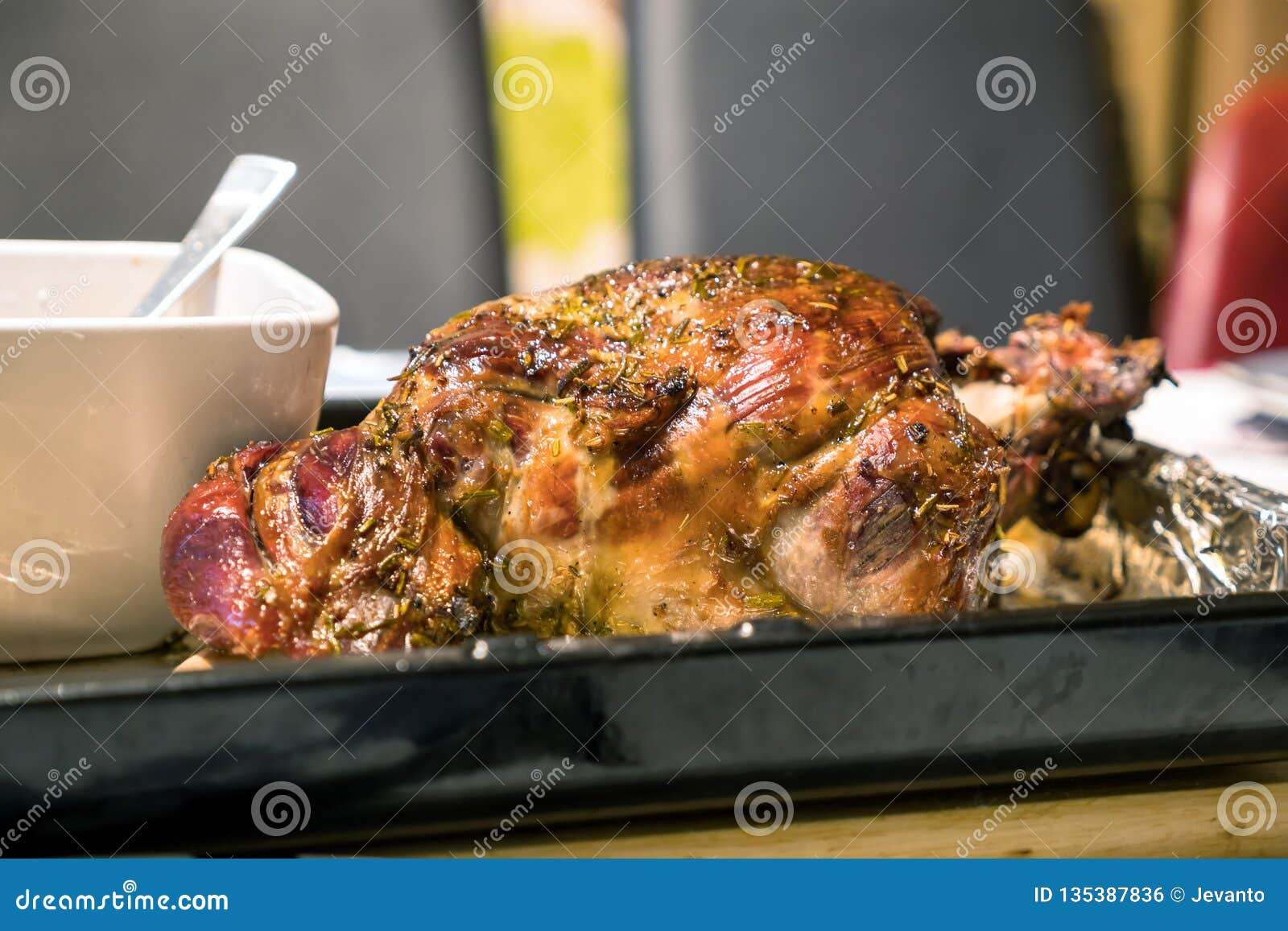 A Roast Leg of Lamb on Baking Tray on Christmas Table Stock Photo ...