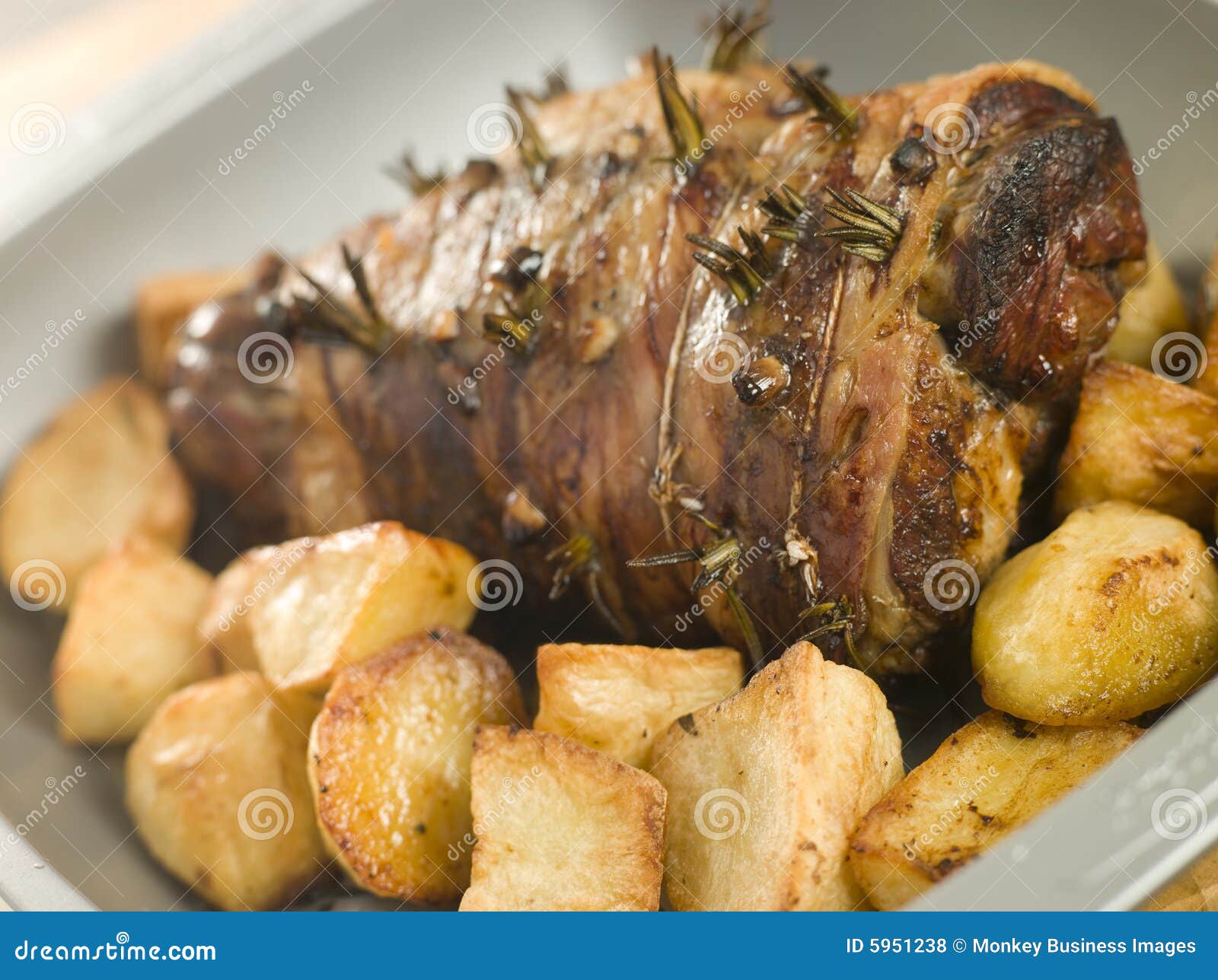 Roast Leg of Lamb Studded with Rosemary and Garlic Stock Photo - Image ... Roast Leg of Lamb Studded with Rosemary and Garlic Stock Photo - Image ...