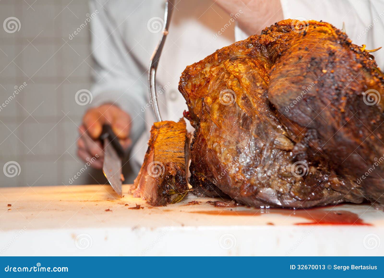 Roast meat is being carved stock image. Image of catering - 32670013