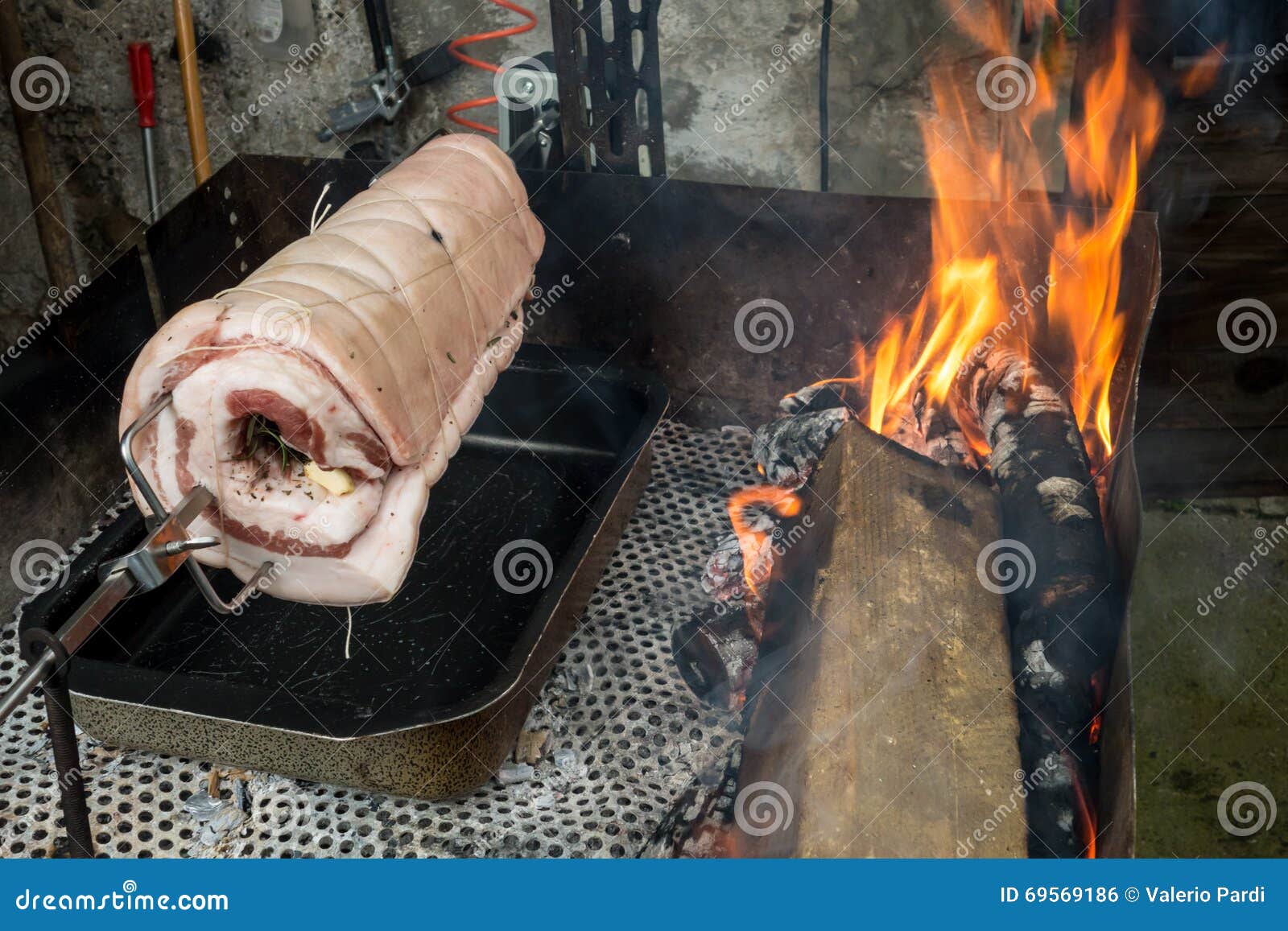 Roast pig on a spit stock photo. Image of domestic, roast - 69569186