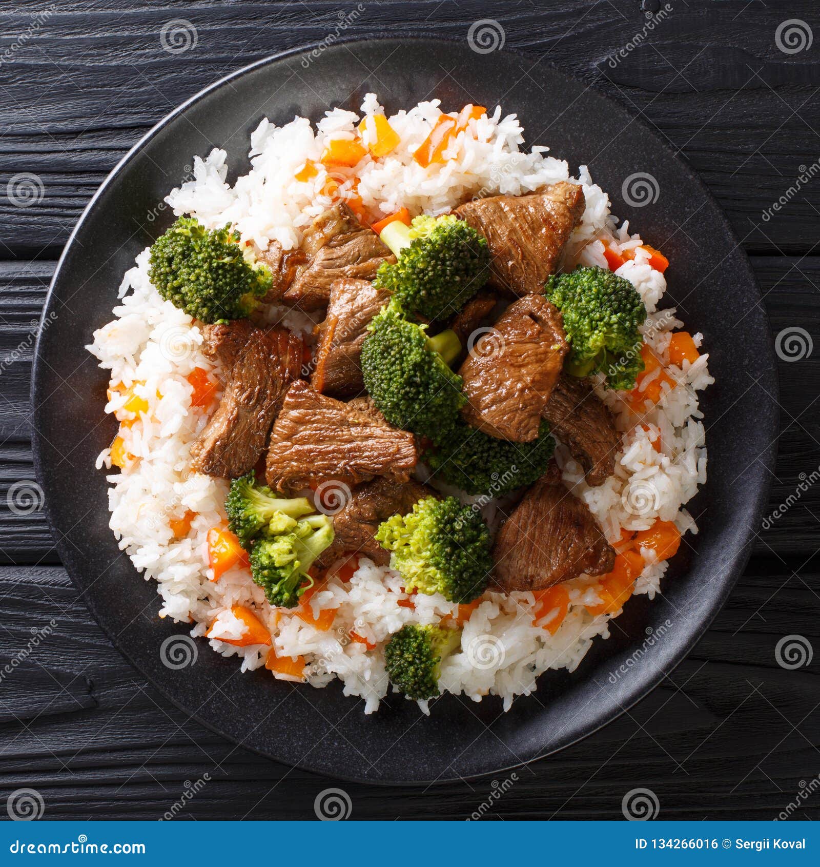 Roasted Beef with Broccoli with Rice and Persimmon Side Dish Close-up ...