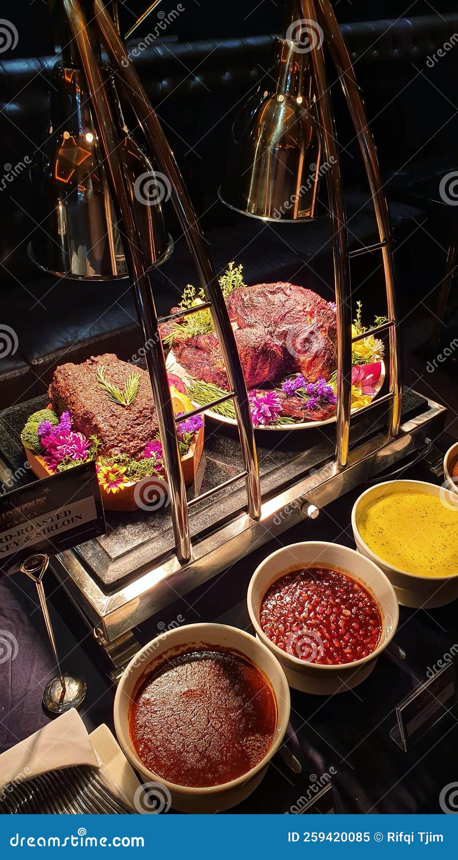 Roasted Beef & Sirloin Display on Carving Lamp Stock Image - Image of ...