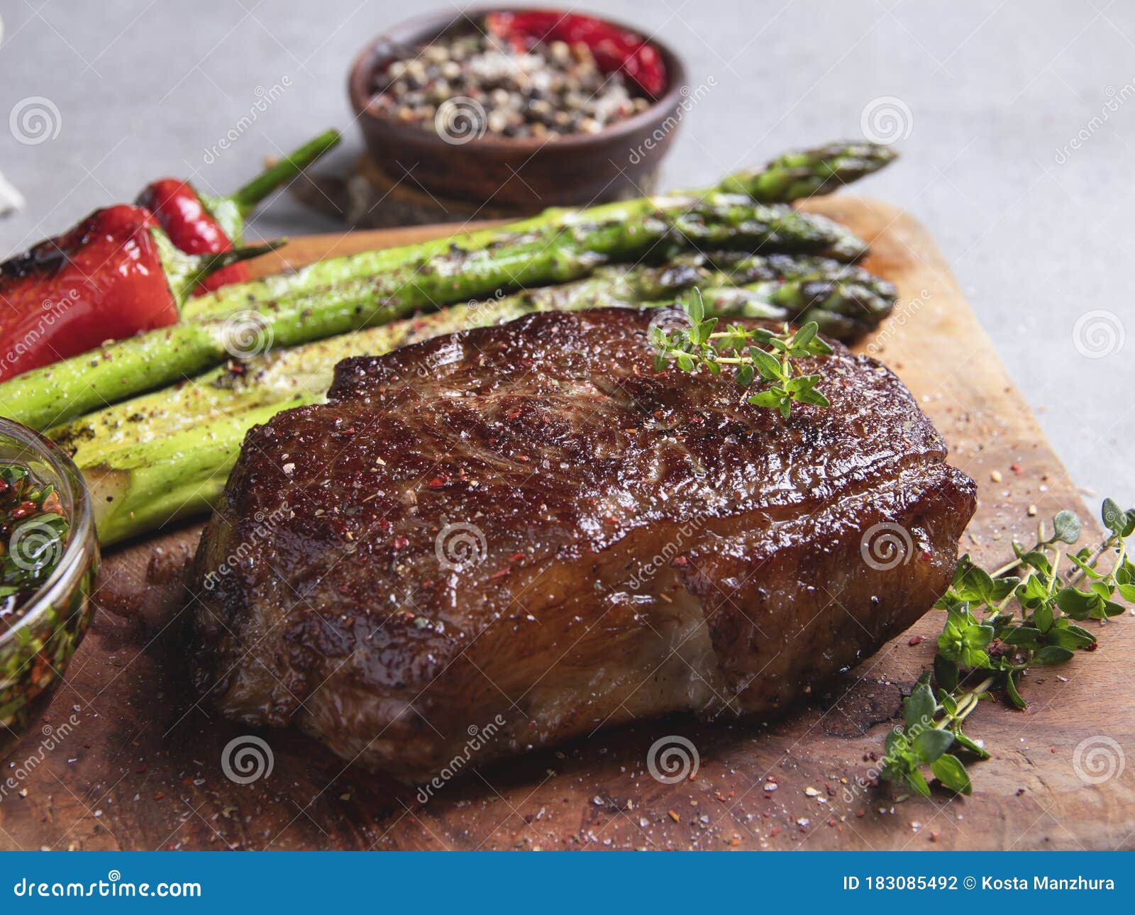 Roasted Beef Steak, Mutton with Asparagus Pepper on a Cutting Board ...