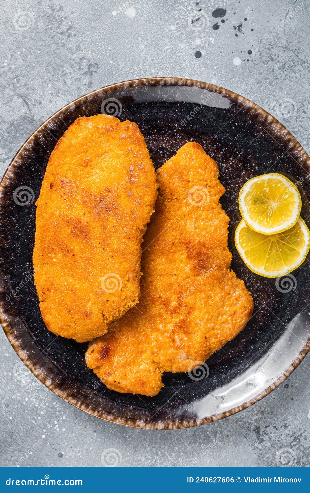 Roasted Breaded German Weiner Schnitzel on a Plate. Gray Background ...