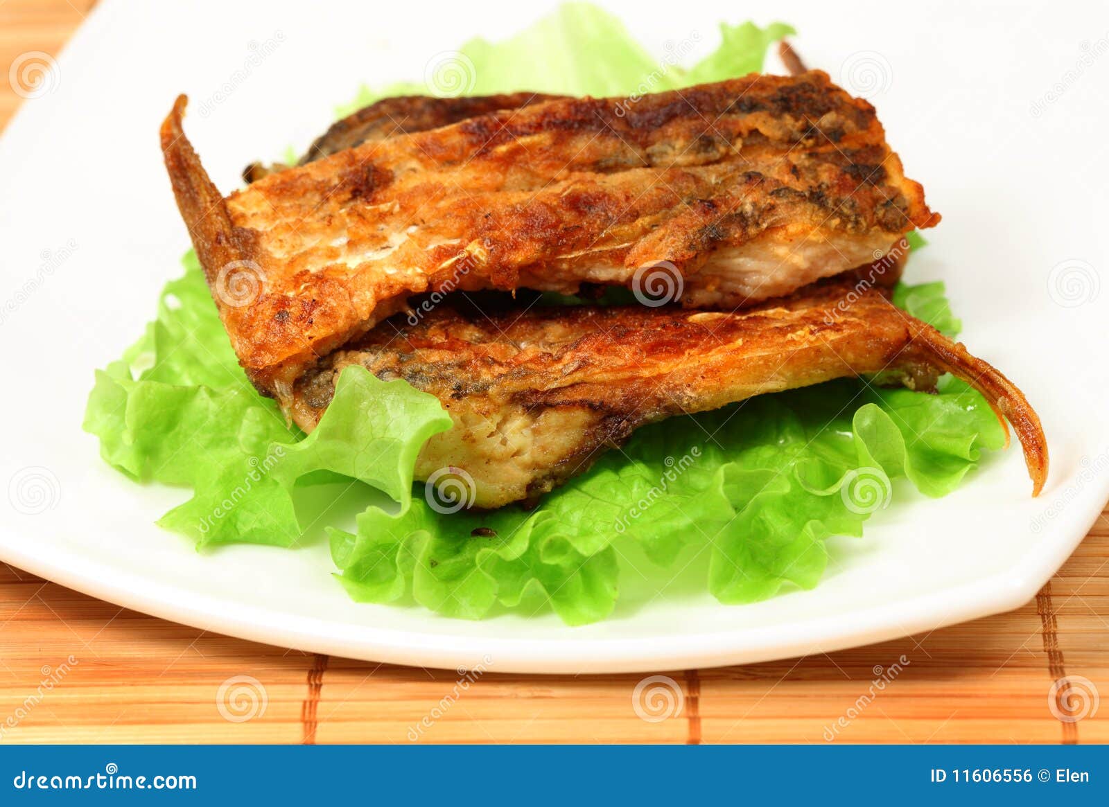 Roasted bream on a plate stock photo. Image of snack - 11606556