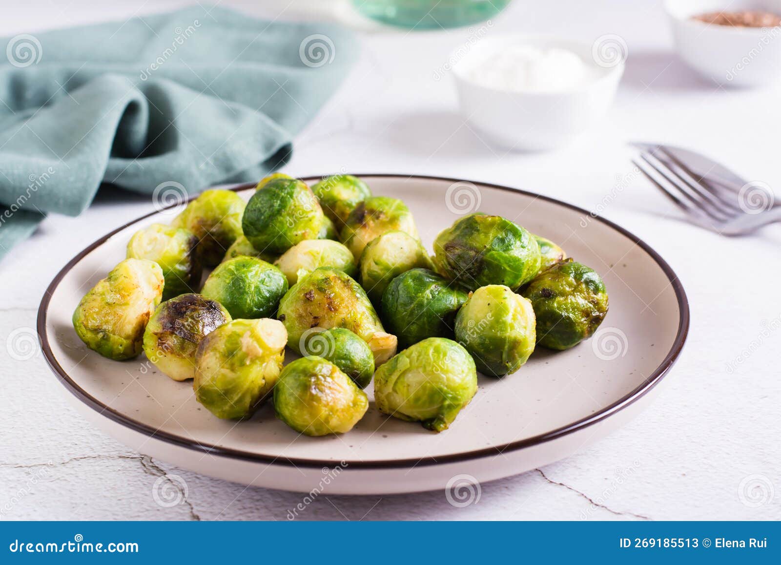 Roasted Brussels Sprouts on a Plate on the Table. Vegetarian Diet Stock ...