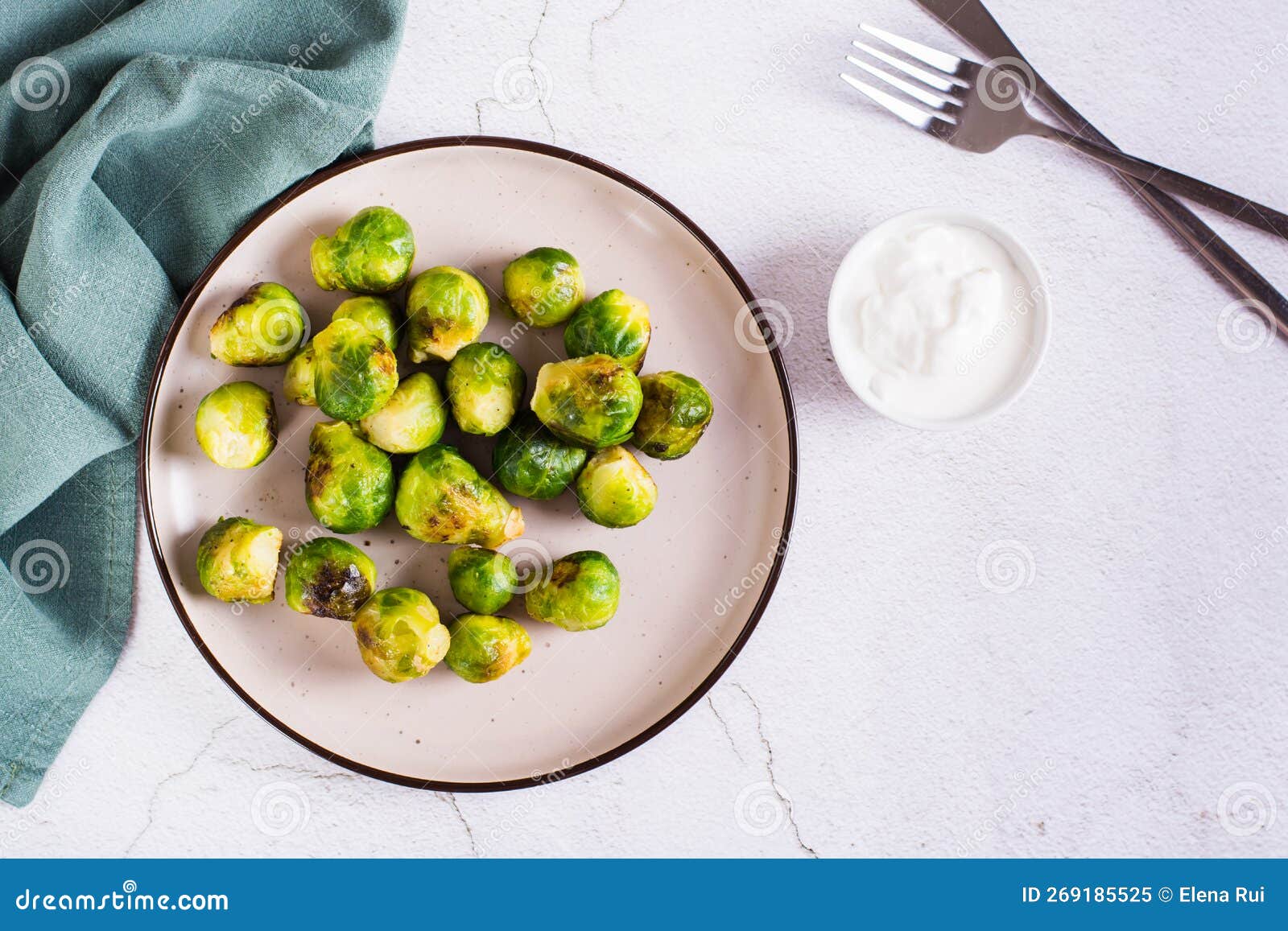 Roasted Brussels Sprouts on a Plate on the Table. Vegetarian Diet Stock ...