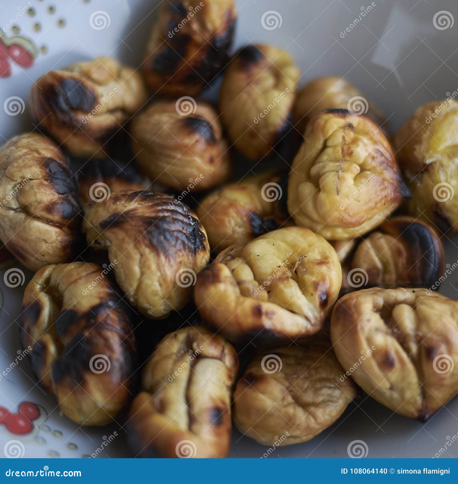 Roasted chestnuts closeup stock photo. Image of macro - 108064140