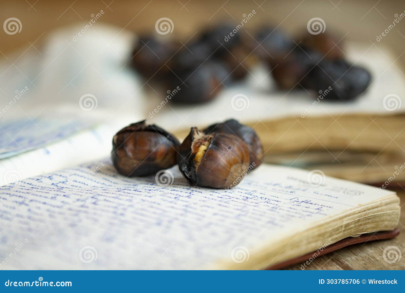 Open Book Filled with Chestnuts, on a Flat Surface Stock Photo - Image ...