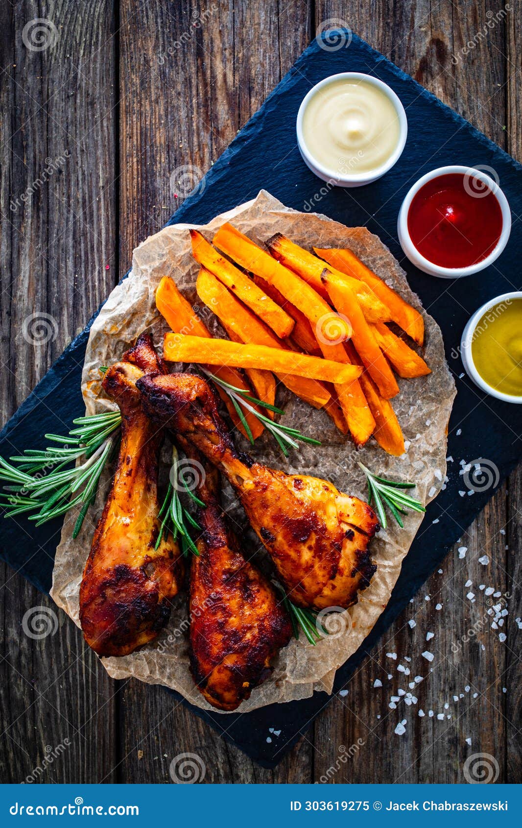 Roasted Chicken Drumsticks With French Fries On Wooden Table Stock Image Image Of Portion