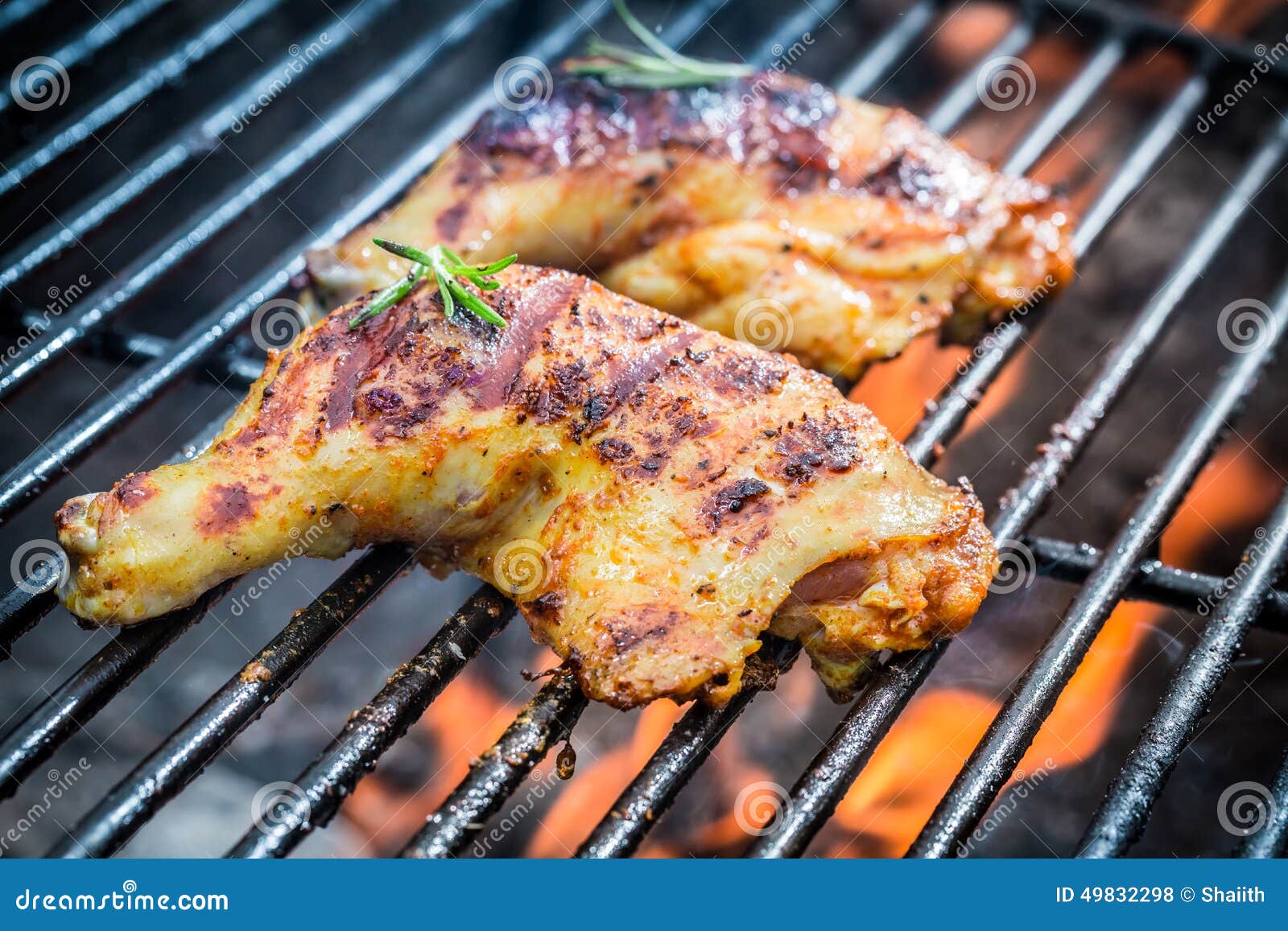 Roasted Chicken Legs on the Grill with Fire Stock Photo - Image of ...