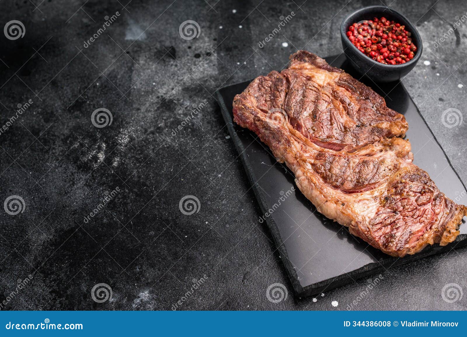Roasted Chuck Eye Roll Steak, Marbled Beef Meat on a Board. Black ...