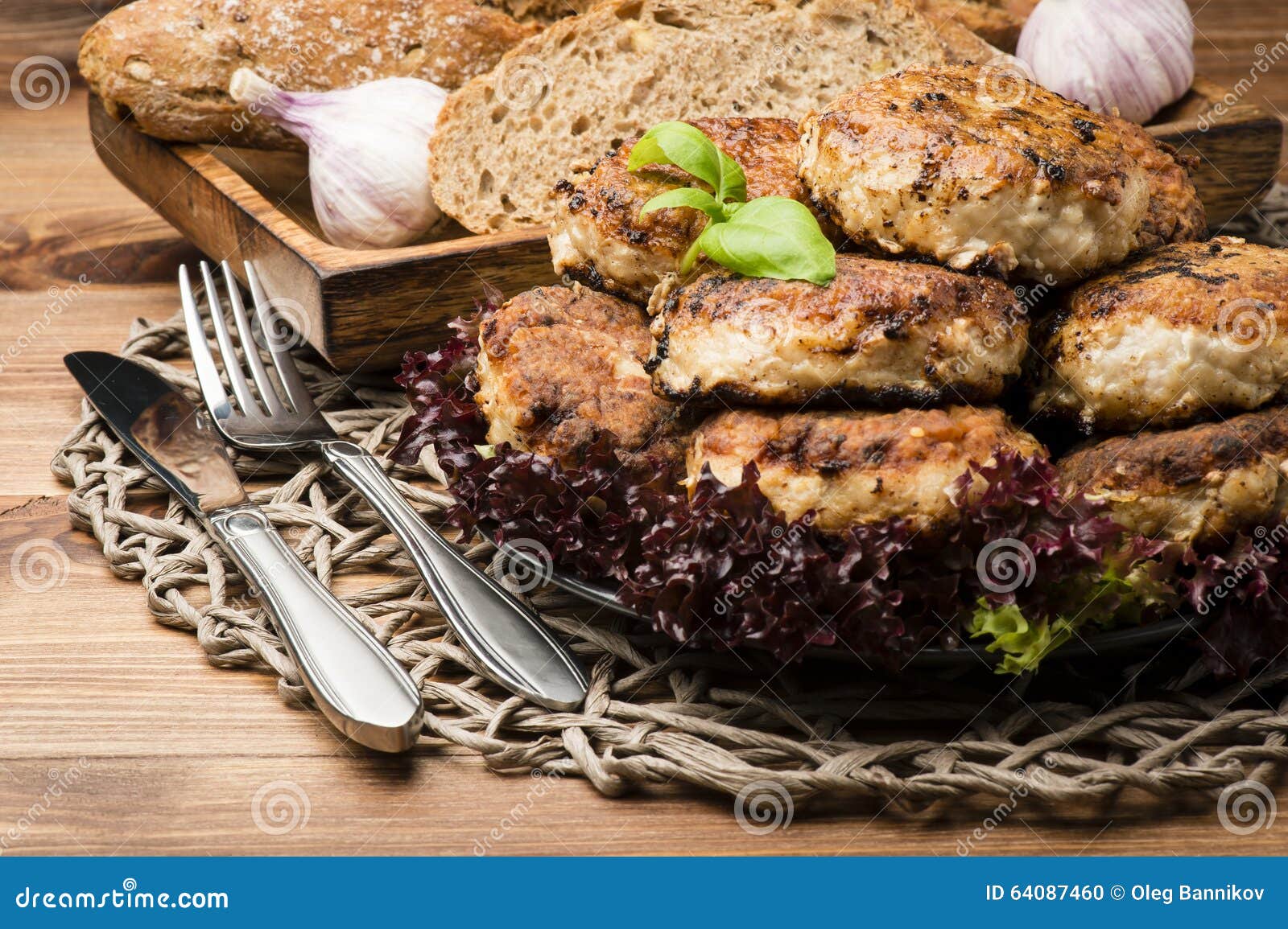 Roasted Cutlets on the Plate on the Wooden Surface. Stock Photo - Image ...