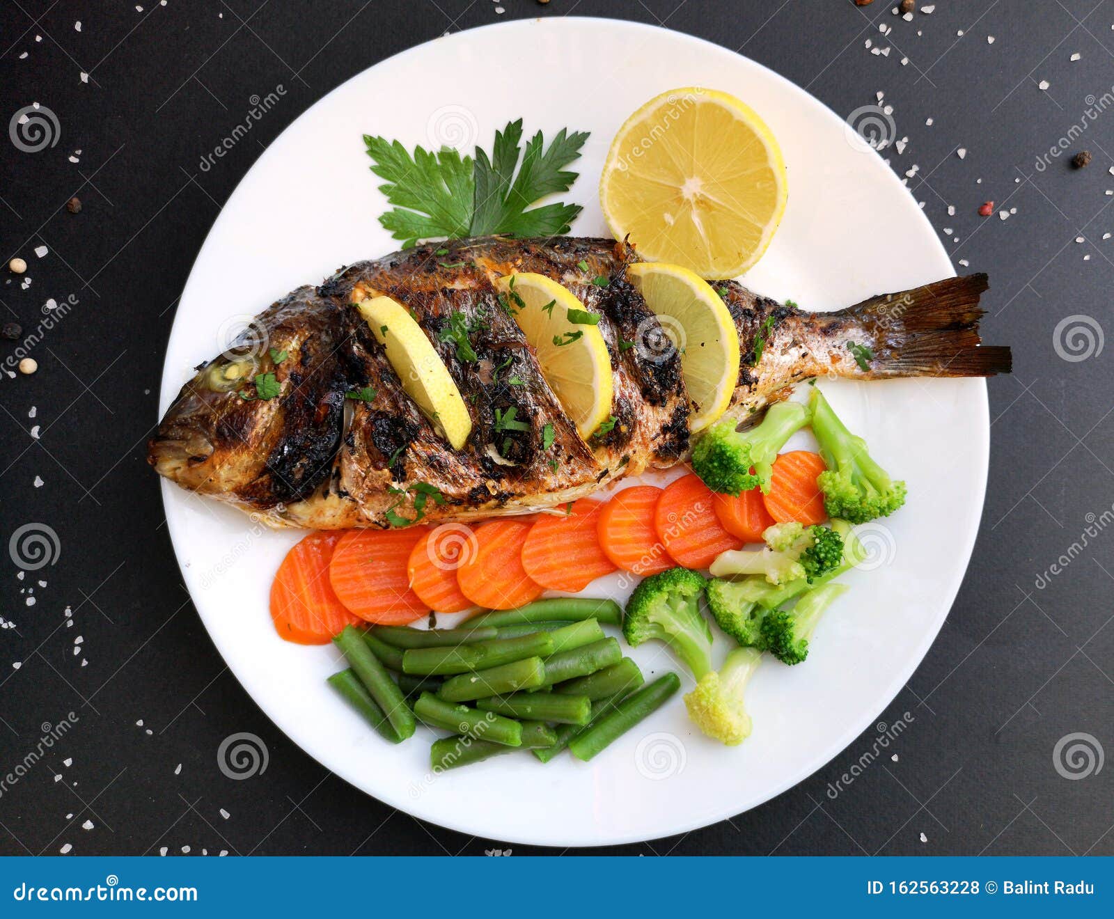 Roasted Dorada Fish with Vegetables Stock Photo - Image of food ...