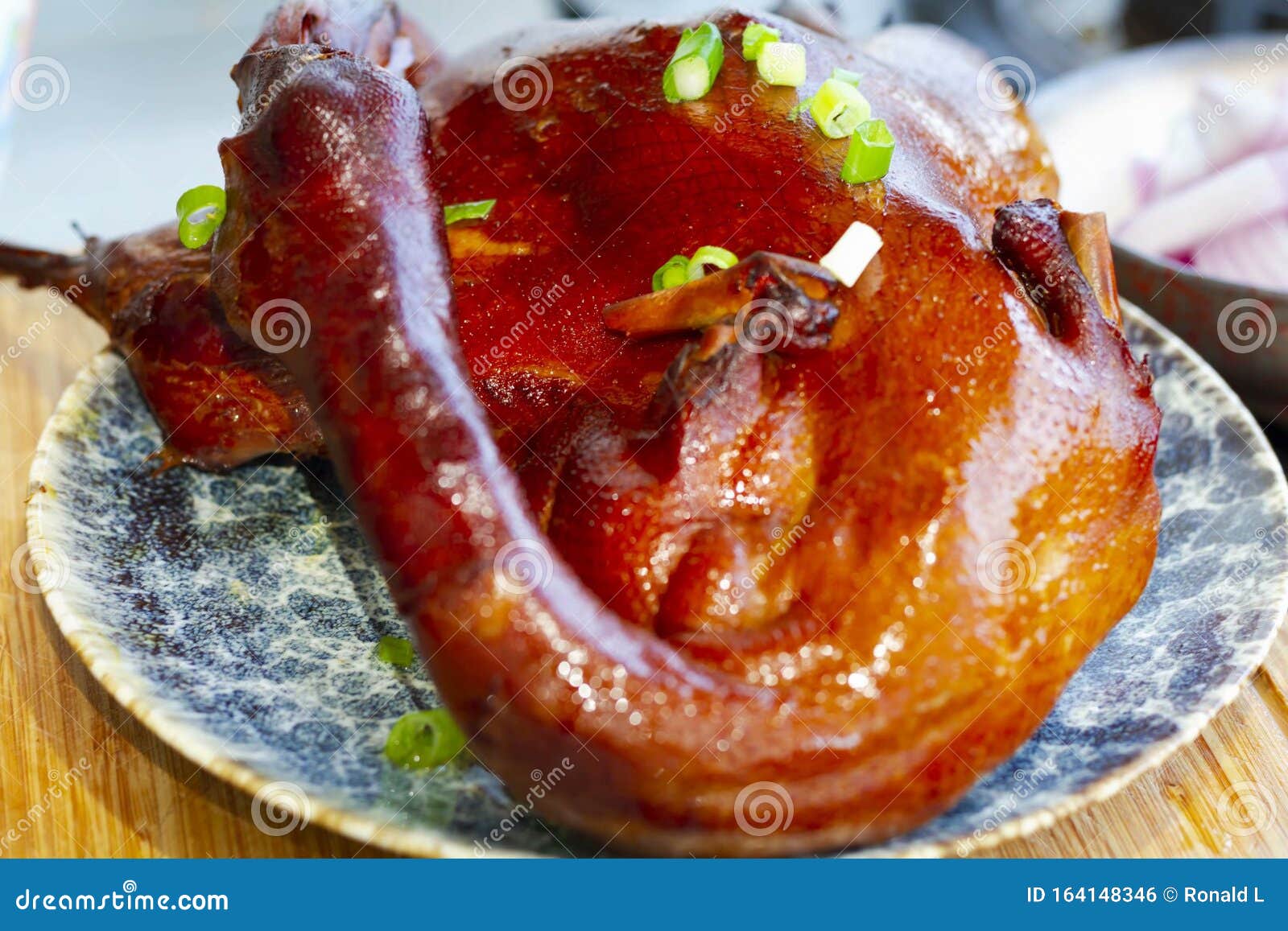 Roasted duck on a plate stock photo. Image of costum - 164148346