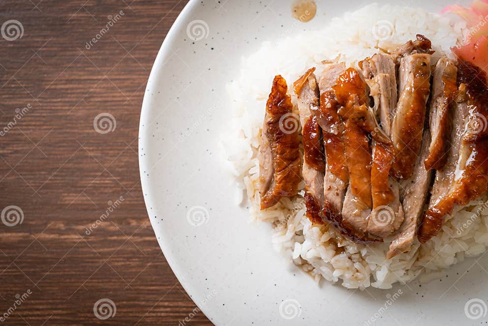 Roasted duck on rice stock photo. Image of broccoli - 256390786