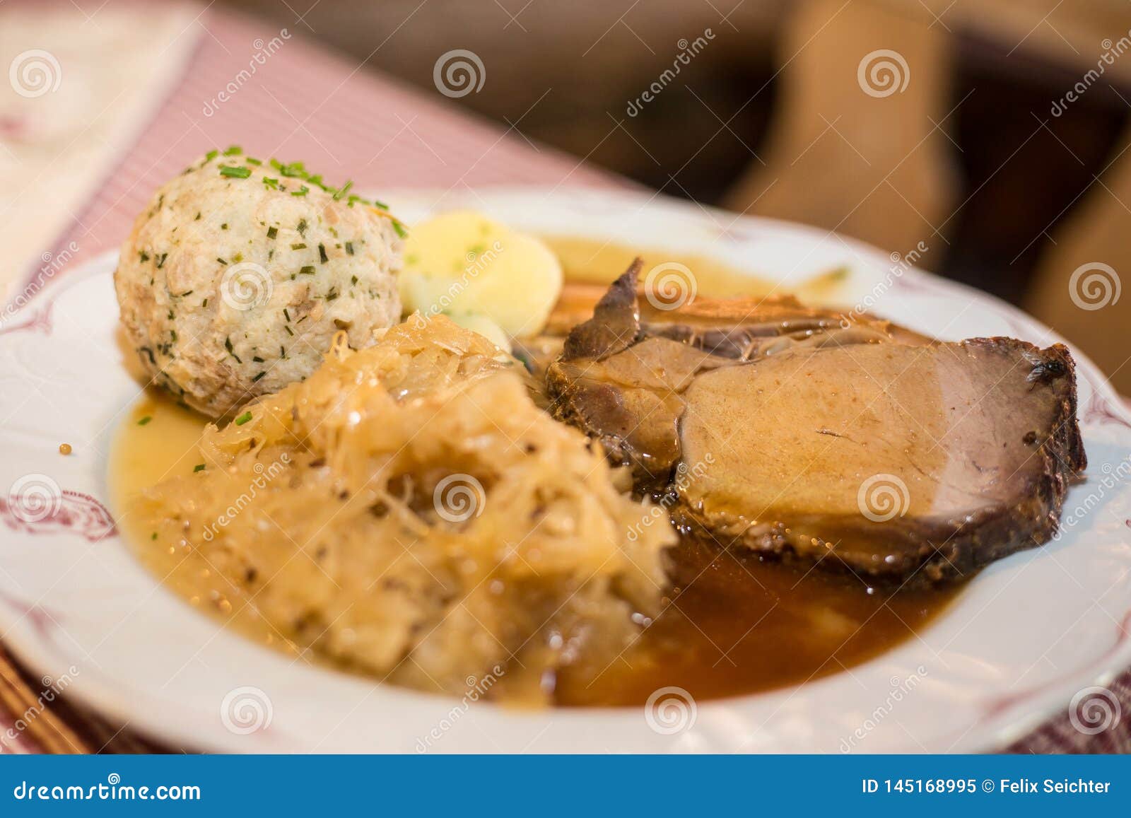 Roasted Eisbein or German Pork Knuckles Served on a Bed of Shredded ...