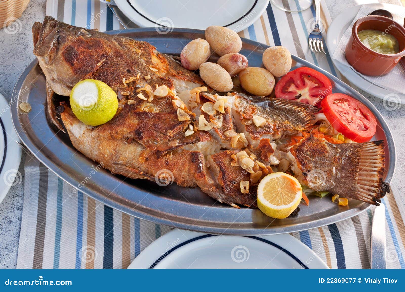 Roasted fish on the plate stock image. Image of cafe - 22869077