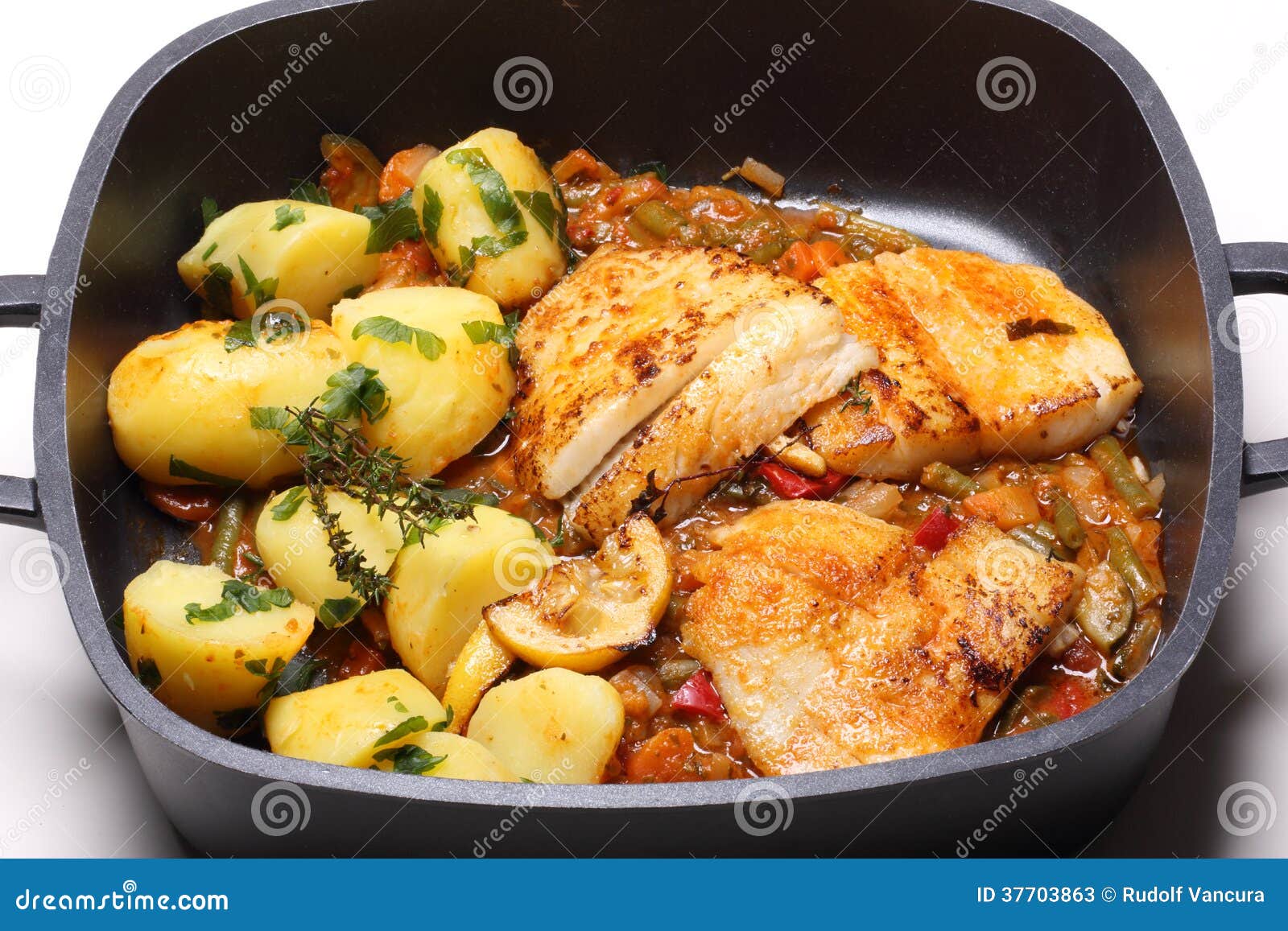 Roasted fish and potatoes stock image. Image of paprika - 37703863
