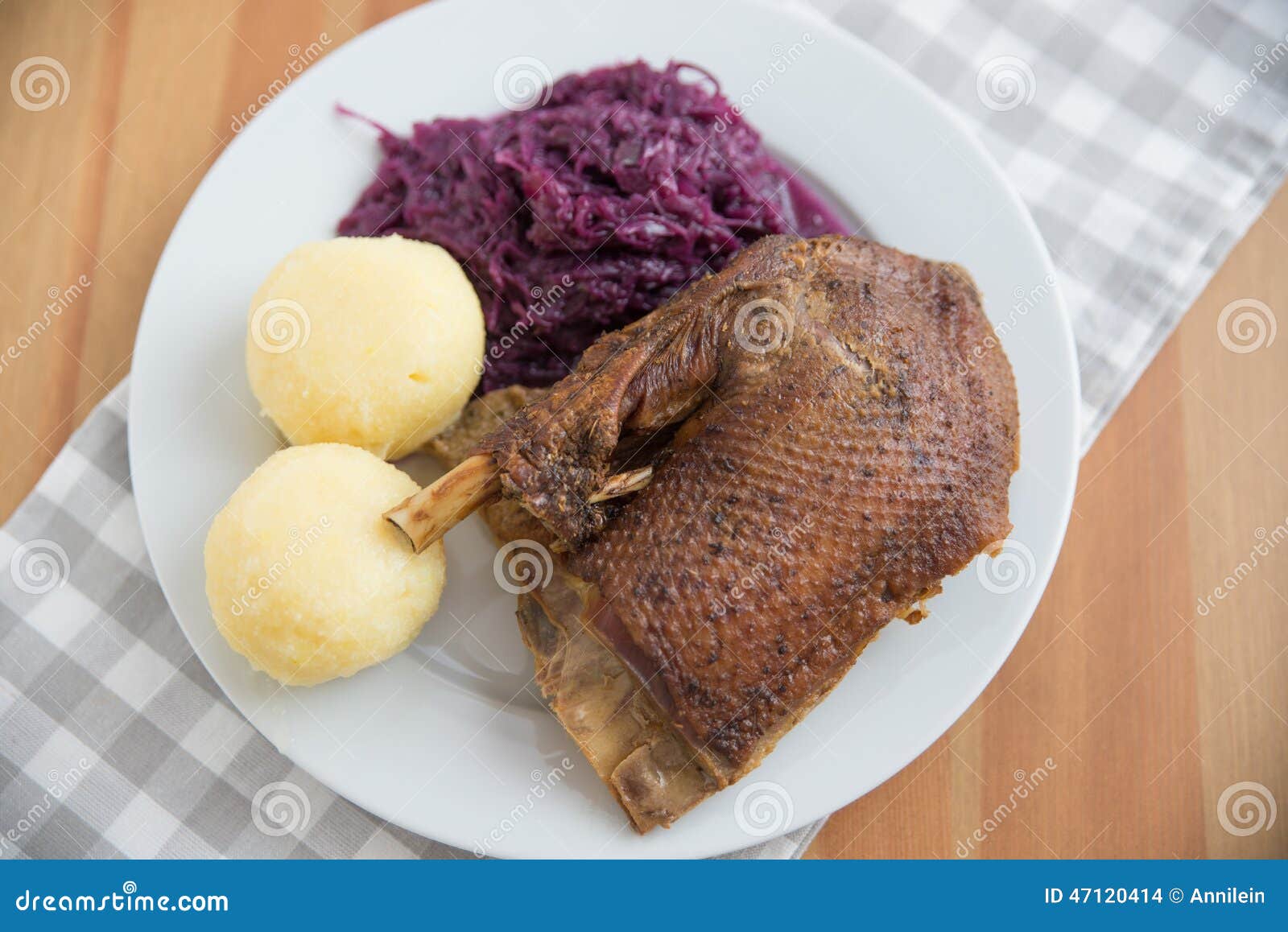Roasted Goose Leg with Braised Red Cabbage Stock Photo - Image of ...