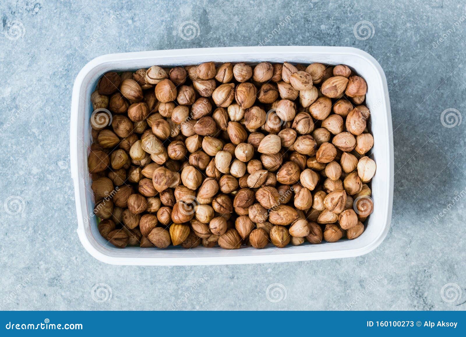 Roasted Macadamia Nuts in Plastic Box Container / Package Stock Image ...
