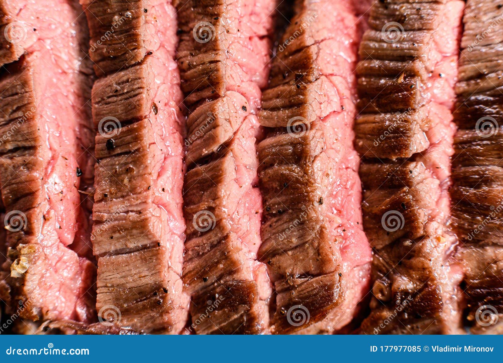 Roasted Medium Rare Sliced Flank Beef Steak. Black Background Stock ...