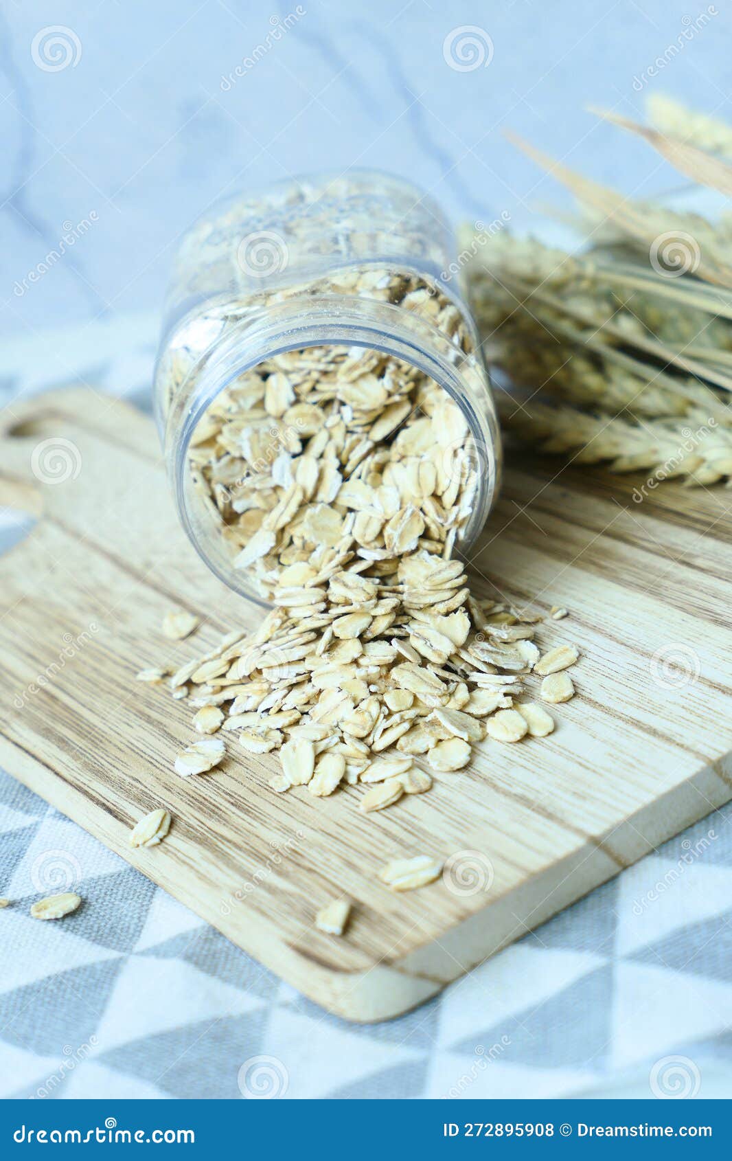 Roasted Oats Flakes Spilling on Table Stock Photo - Image of wood ...