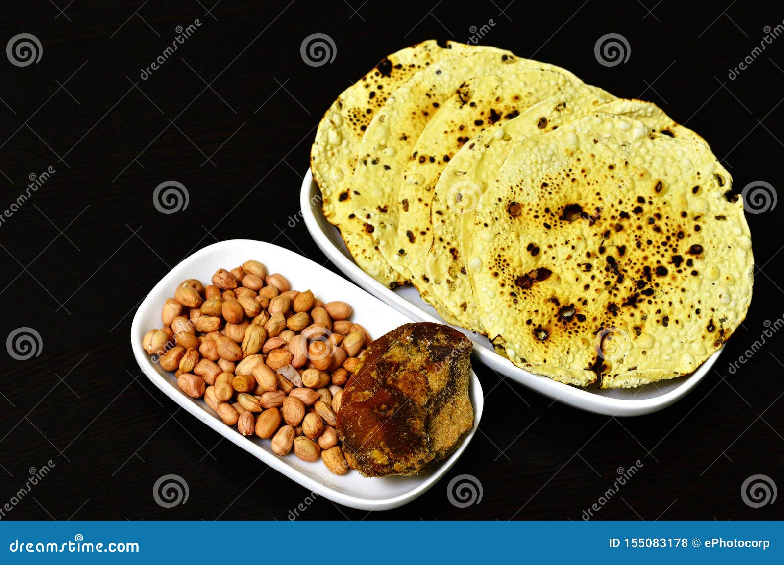 Roasted Papad an Indian Snack with Whole Peanuts and Jaggery in a Plate ...